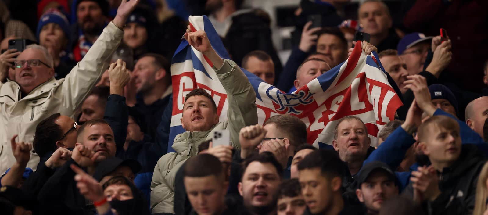 Rangers fans enter home crowd at Old Trafford during Europa League tie ...